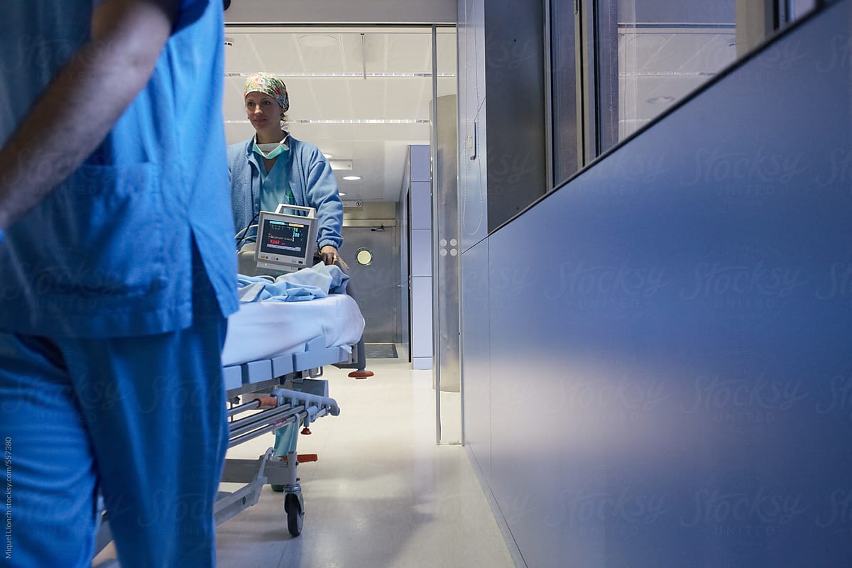 "Transfer Of Patient In A Bed In The Hospital" by Stocksy Contributor ...