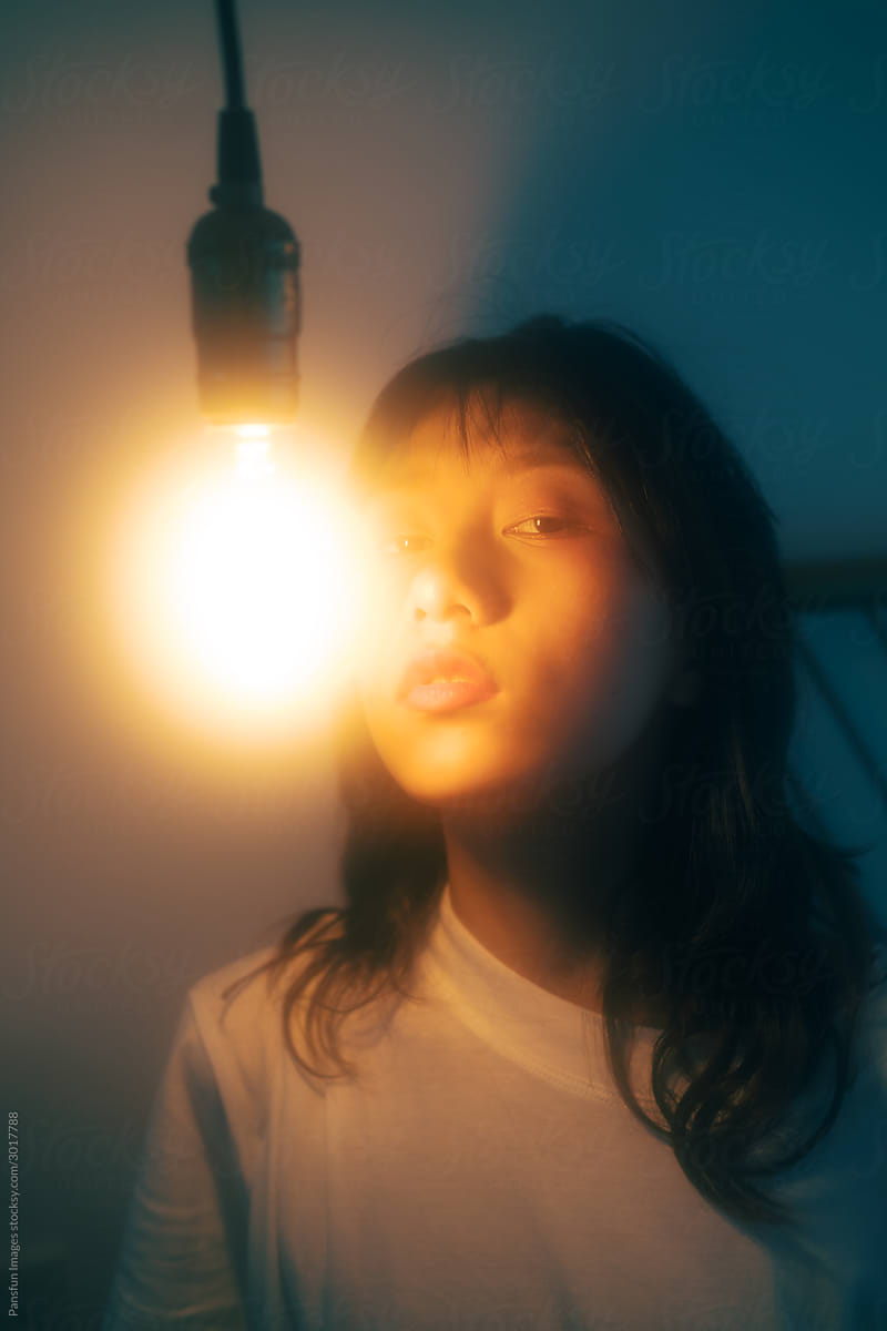 "Asian Female Portrait With Light Bulb" by Stocksy Contributor "Pansfun ...