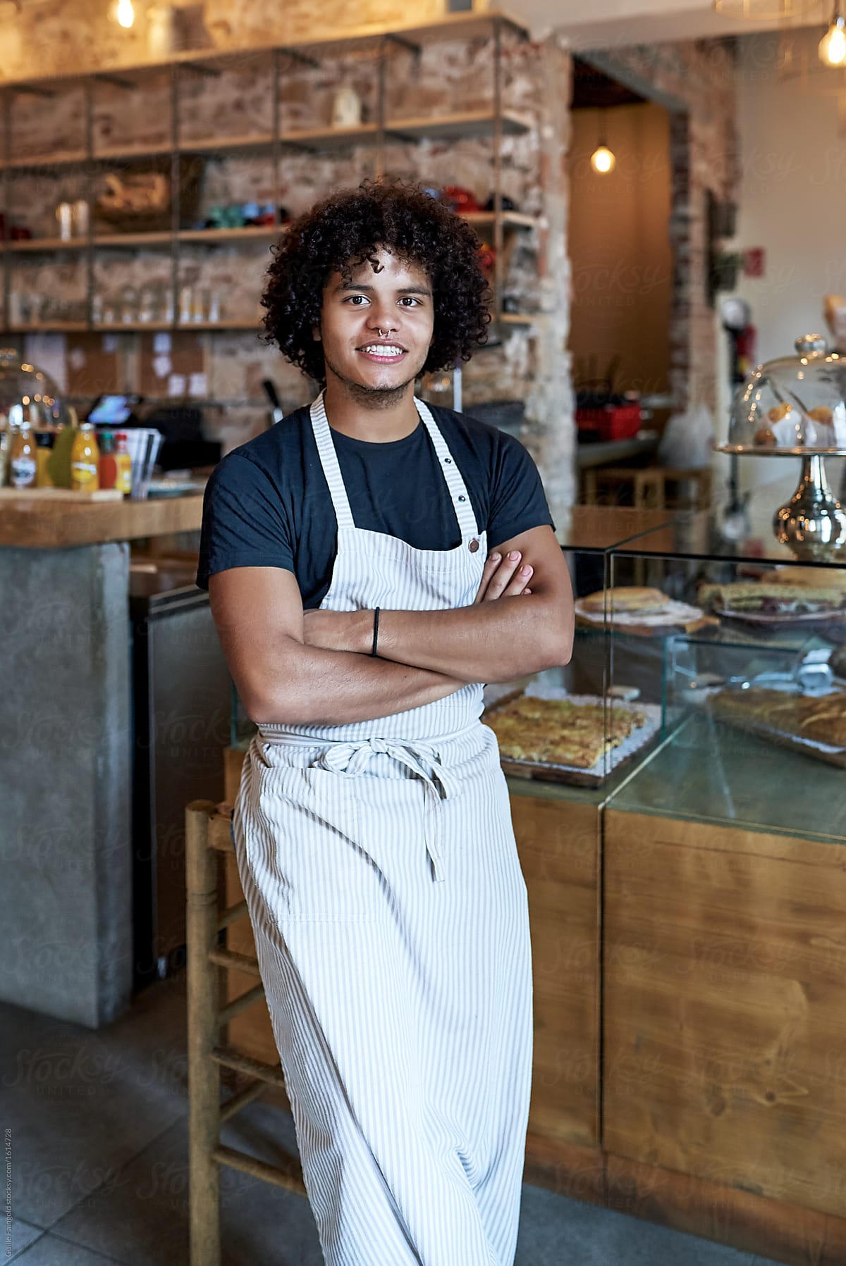 "Cheerful Man Posing In Cafe" by Stocksy Contributor "Guille Faingold ...