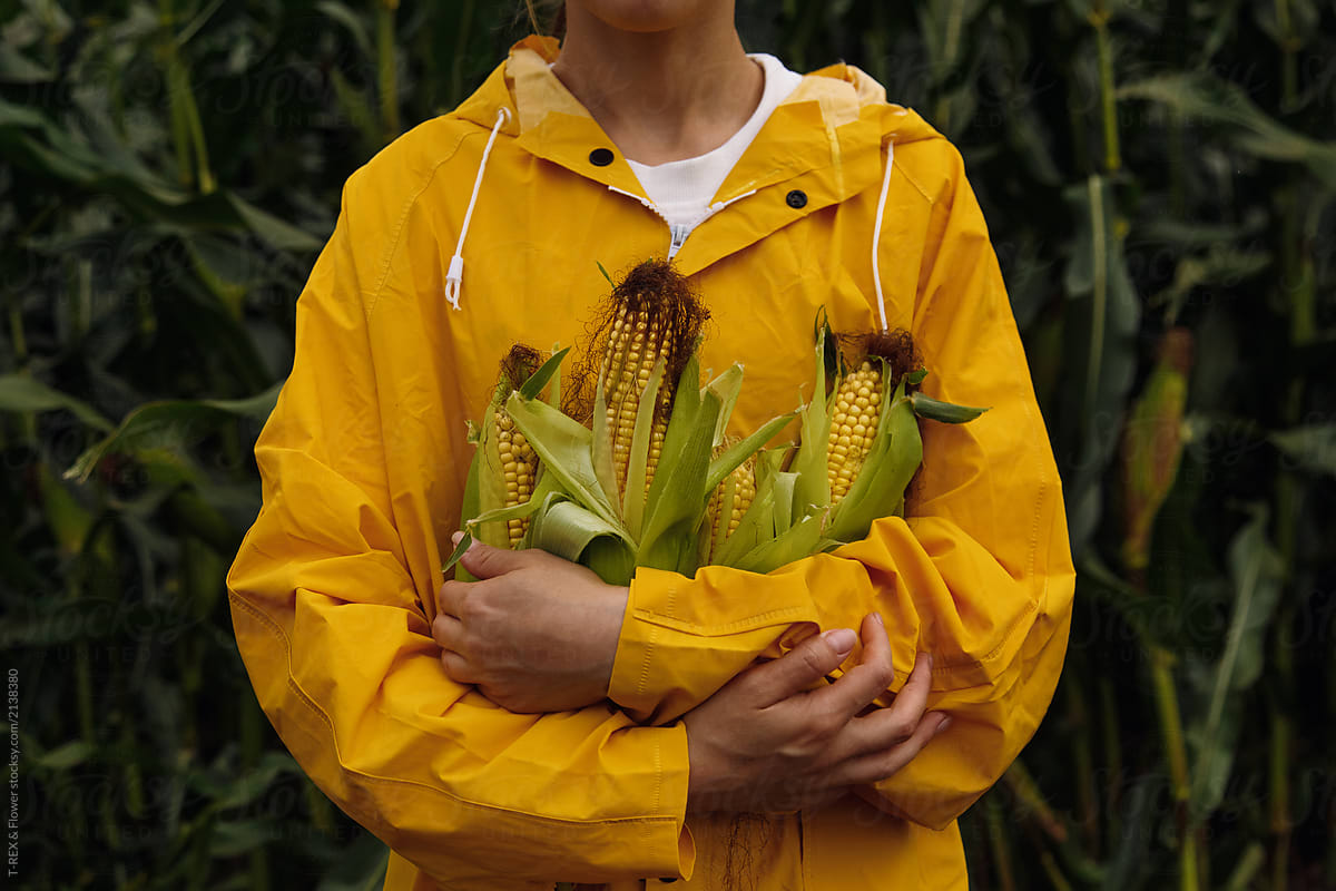 "Crop Woman With Corn" by Stocksy Contributor "Danil Nevsky" - Stocksy