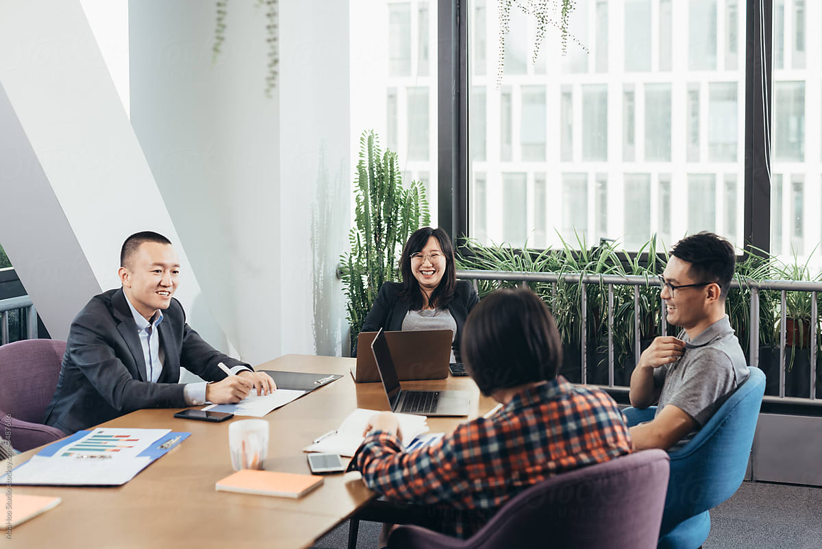 "Asian People Working In Office" by Stocksy Contributor "MaaHoo" - Stocksy