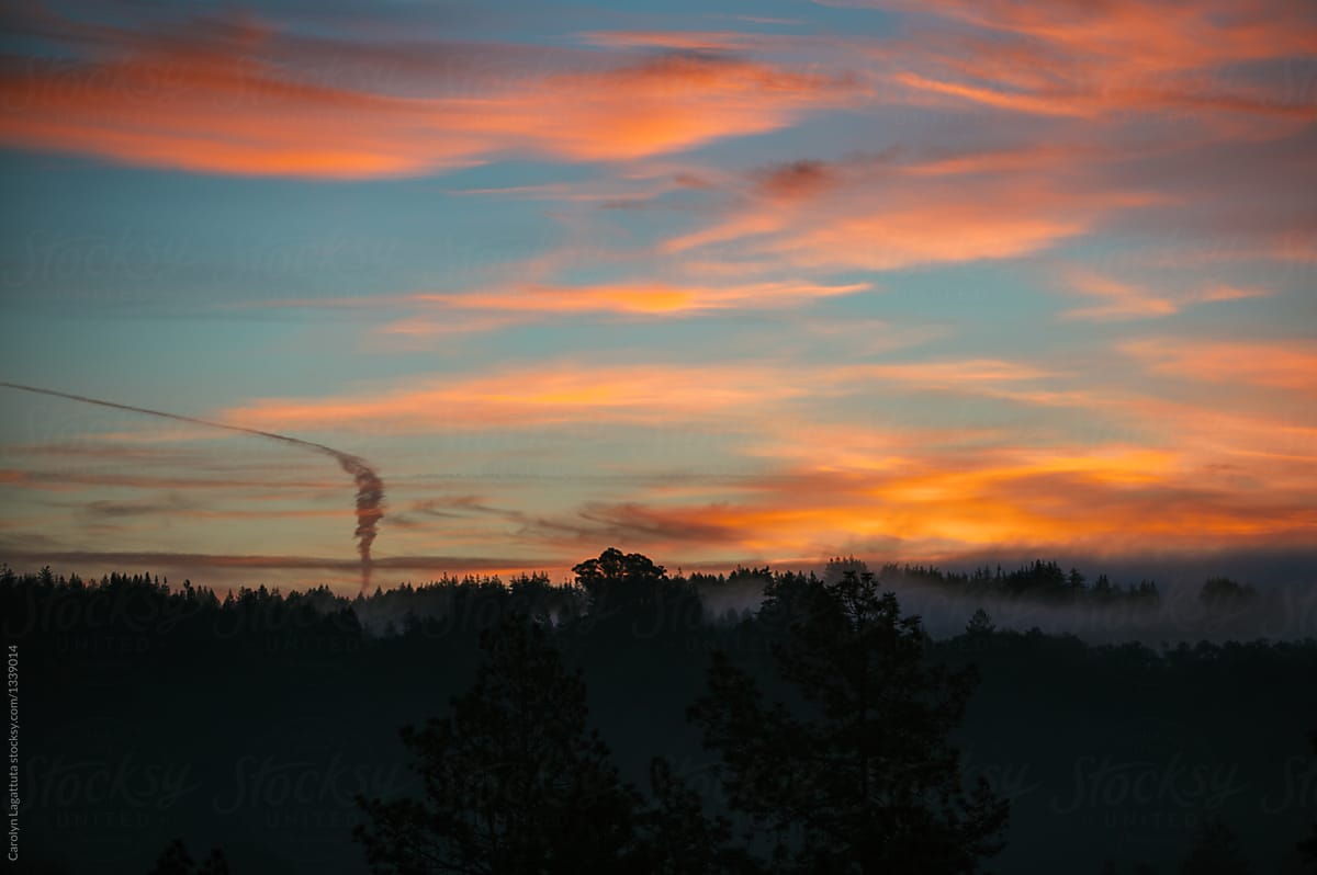 "Dramatic Sunrise With Fog And Interesting Clouds" by Stocksy ...