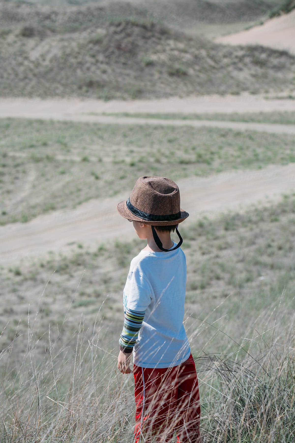 "Portrait Of A Young Boy With His Back To The Camera" by Stocksy ...