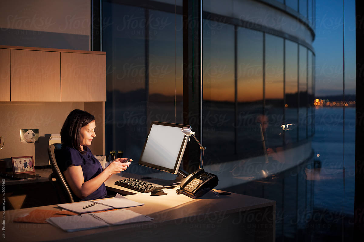 "Female Executive Working At Night" by Stocksy Contributor "Walter And ...