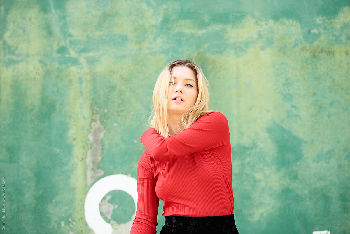"Pretty Woman Touching Shoulder" by Stocksy Contributor "Guille ...