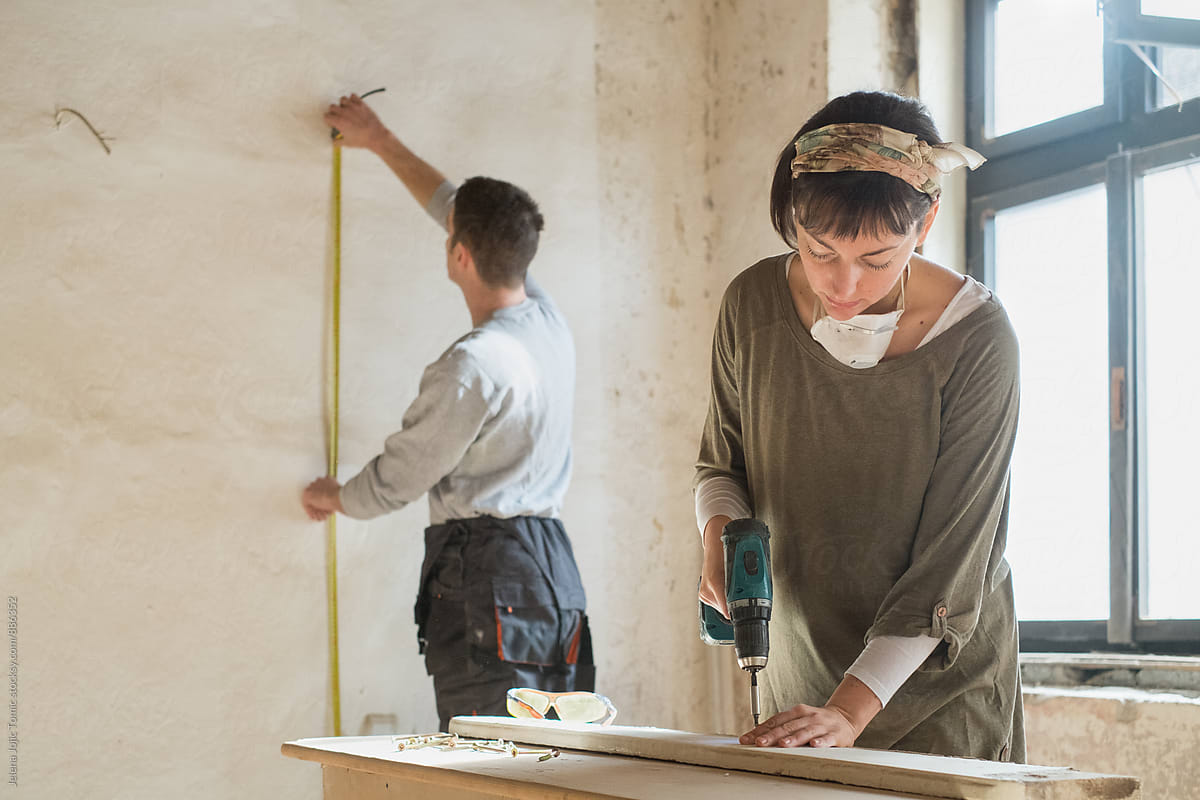 "Couple Working On Home Renovation" by Stocksy Contributor "Jelena ...