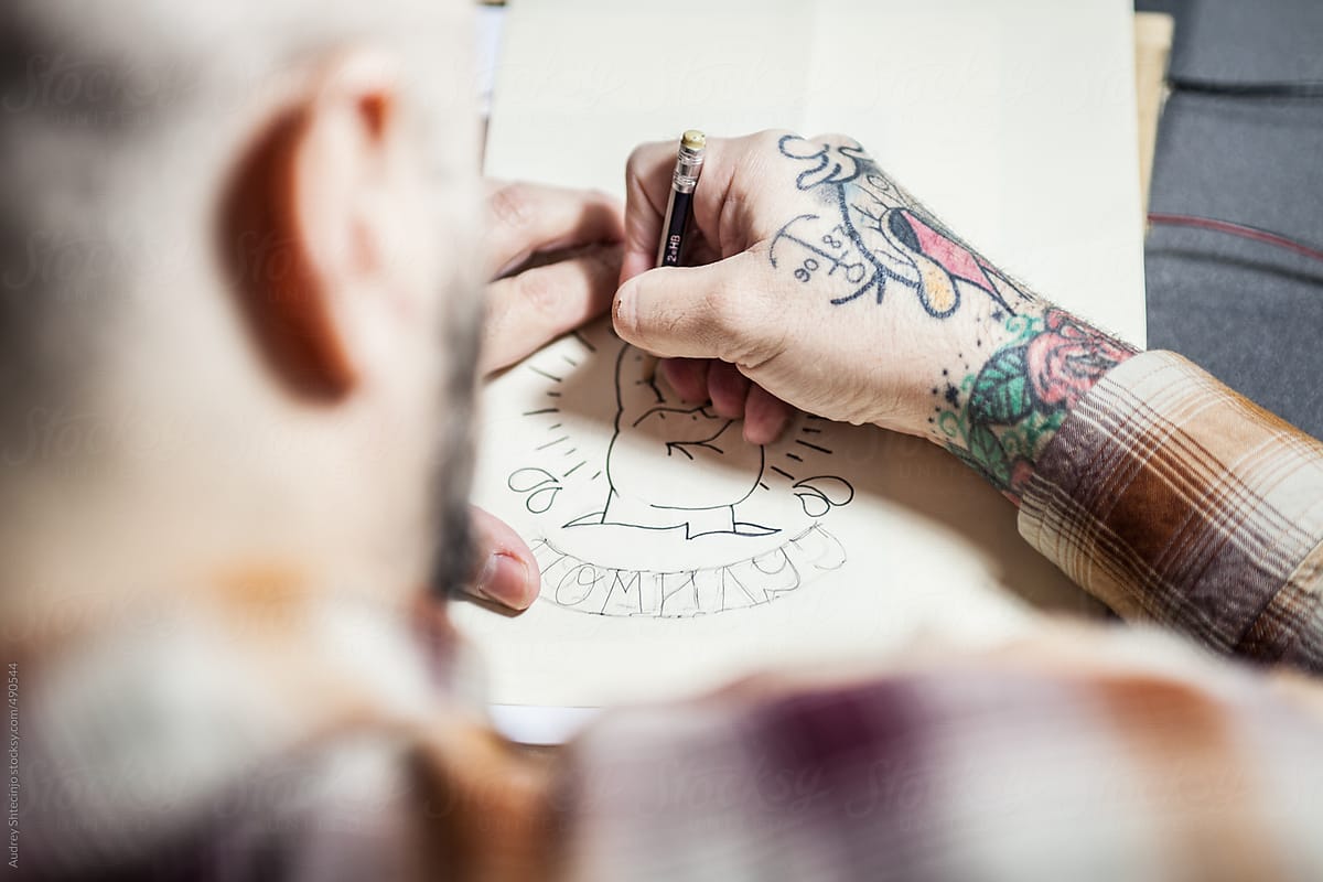 "Tattoo Artist Drawing New Tattoo Sketch." by Stocksy Contributor ...