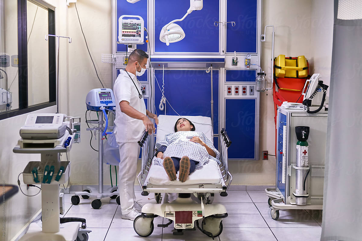 "Doctor And A Patient At An ICU" by Stocksy Contributor "PER Images ...