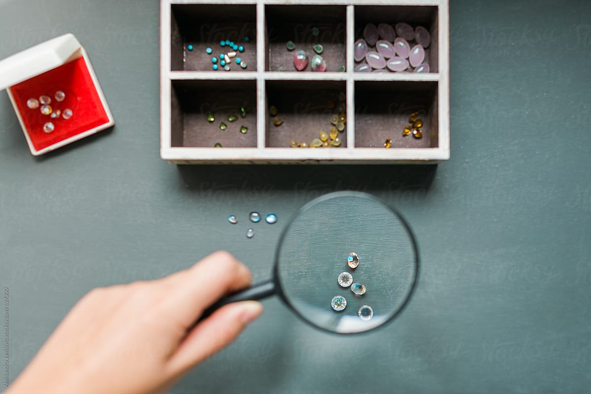 "Person Looking At The Precious Stones Through The Magnifying Glass" by ...