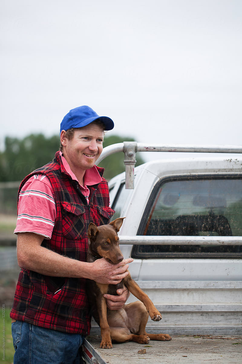 "Young Dairy Farmer Playing With Kelpie Working Dog" by Stocksy ...