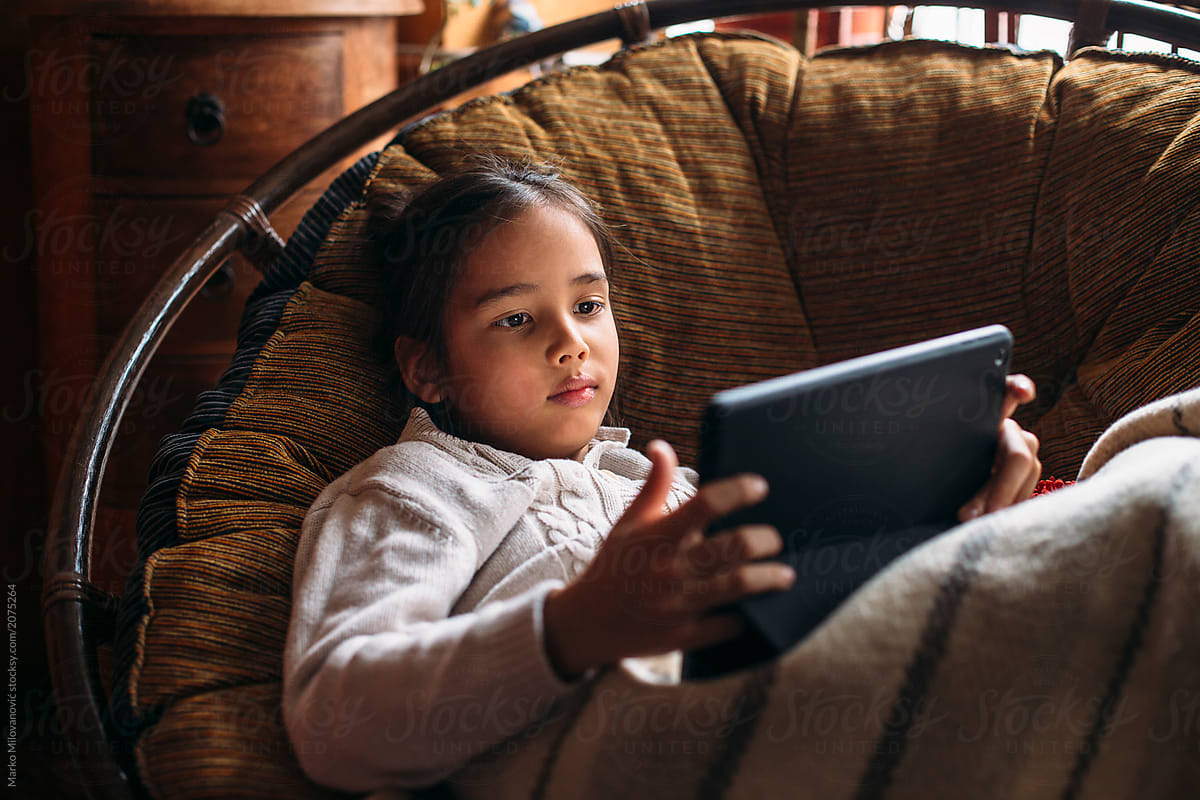 "Boy Using Tablet At Home" by Stocksy Contributor "Marko" - Stocksy
