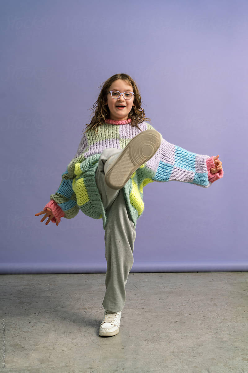 "Cheerful Girl Jumping In Studio" by Stocksy Contributor "Javier Díez ...