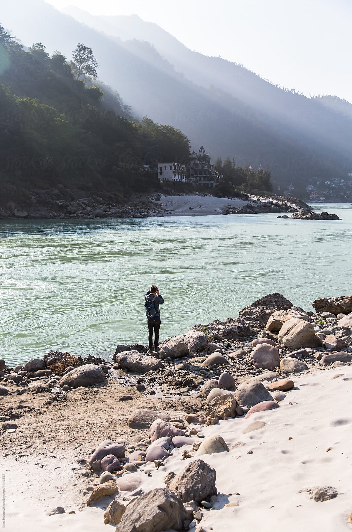 "Man Looking At The River At Sunrise" by Stocksy Contributor "Jovo ...