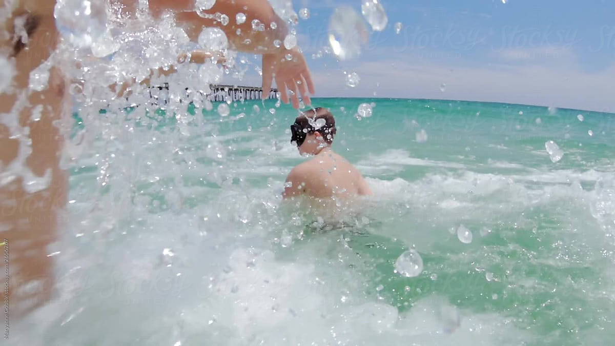 "Kids Playing In The Summer Ocean" by Stocksy Contributor "Maryanne ...