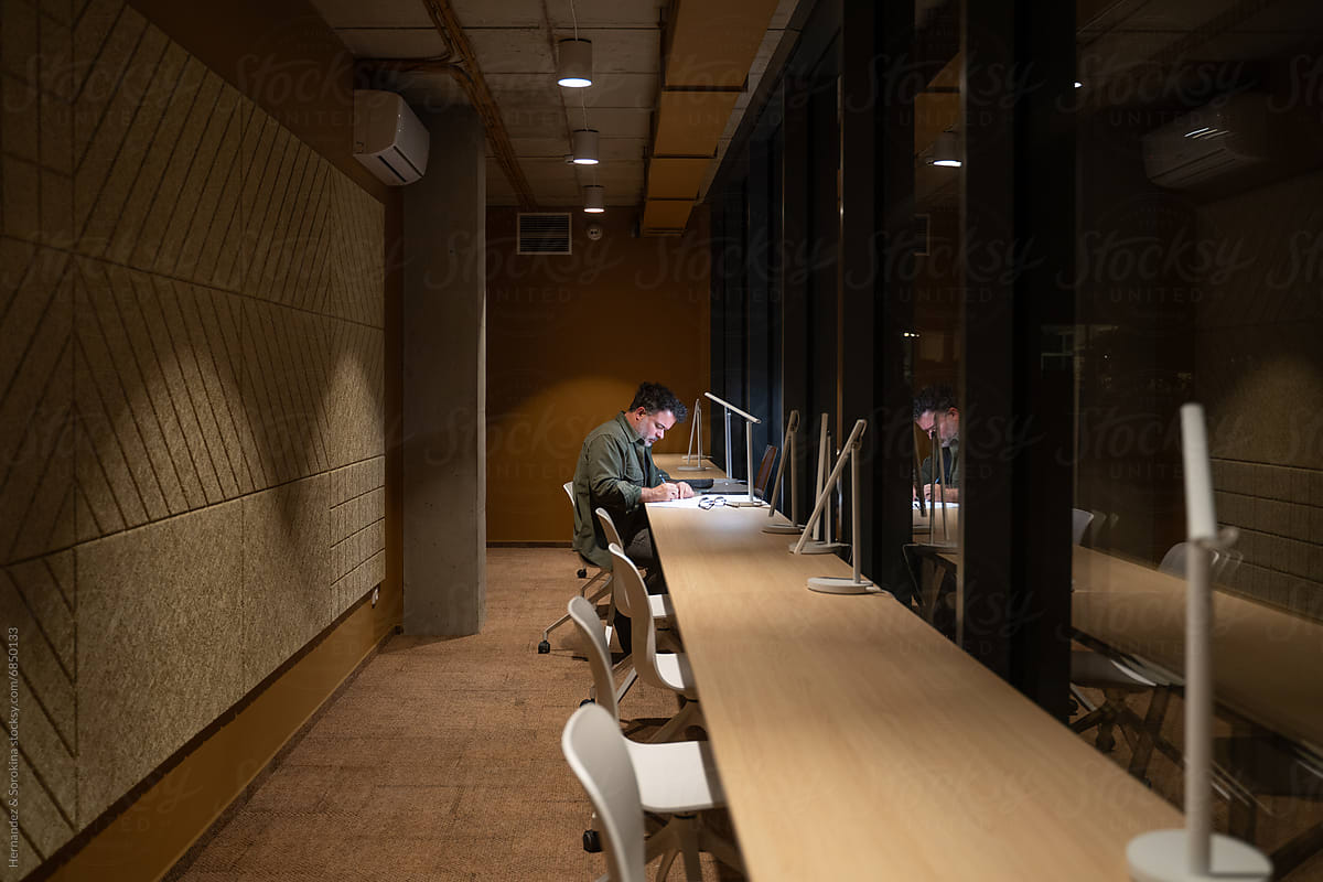 "Man Working At Late Night At Empty Office Room" by Stocksy Contributor ...