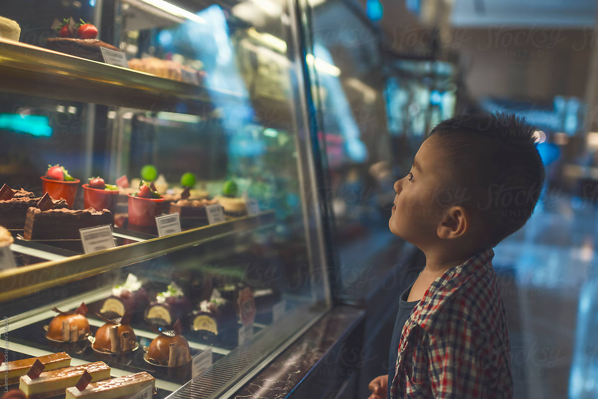"Kid Looking At Cakes In Cabinet" by Stocksy Contributor "Lawren Lu ...