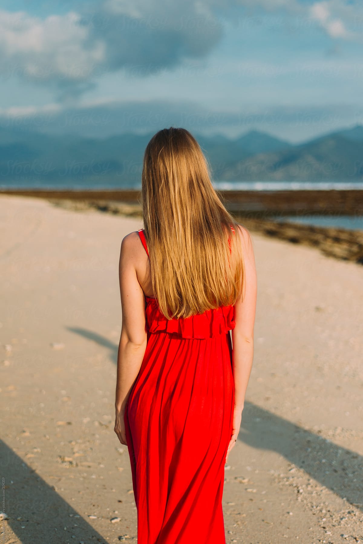"Woman In Red Outdoors" by Stocksy Contributor "Alexander Grabchilev ...