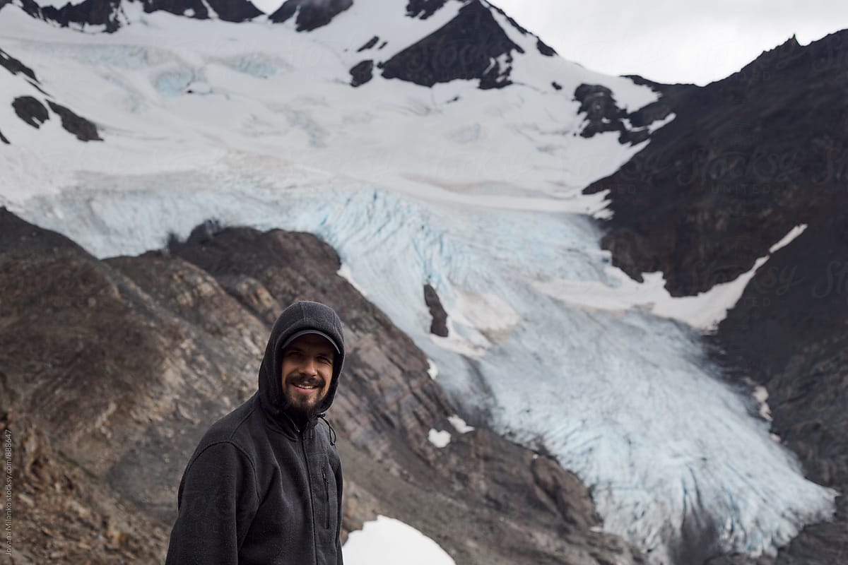 "Portrait Of A Man Standing In Front Of A Glacier" by Stocksy ...