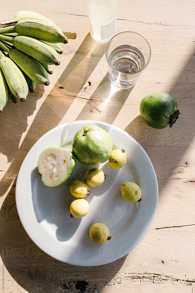"Citrus Fruit On Wood Table" by Stocksy Contributor "Ali Harper" - Stocksy