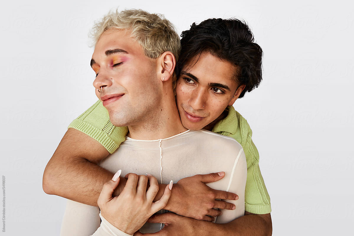 "Affectionate Embrace: Young Queer Friends On White Backdrop." by ...