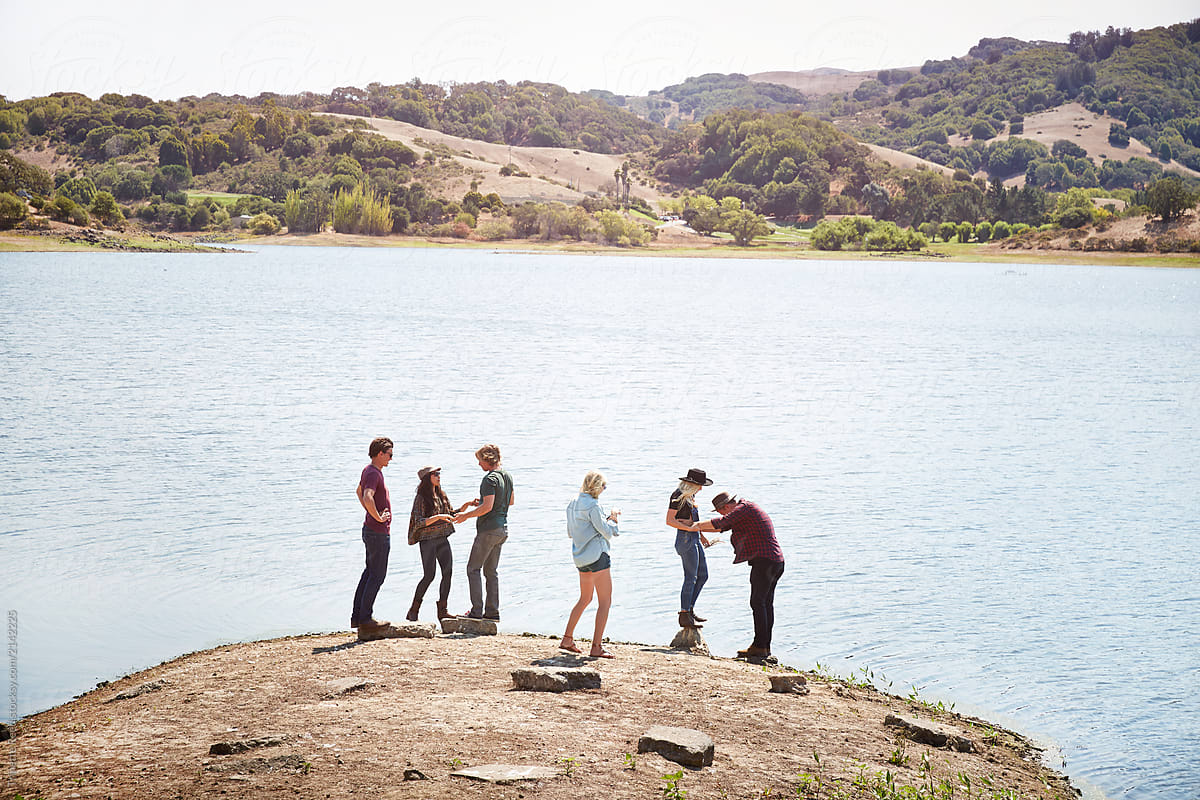 "Group Of Friends Hanging Out In Nature By Lake" by Stocksy Contributor ...
