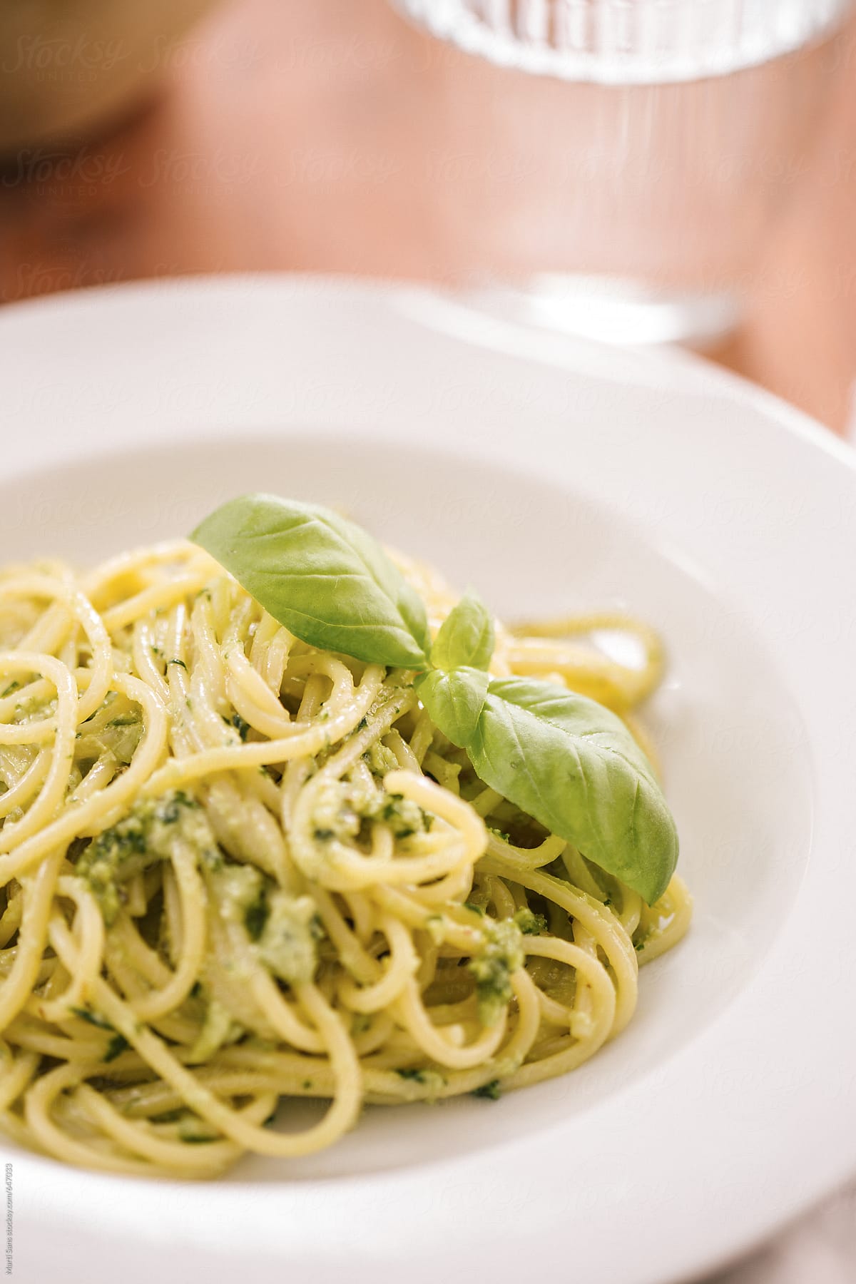 "Spaghetti Al Pesto, Basil" by Stocksy Contributor "Martí Sans" - Stocksy