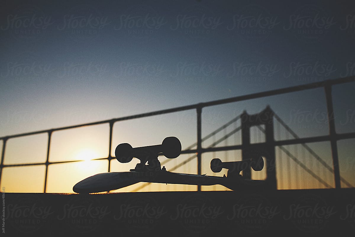 "Skateboard In Sunset" by Stocksy Contributor "Jeff Marsh" - Stocksy