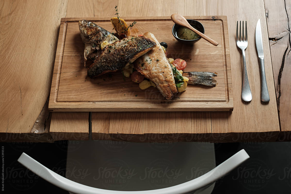 "Fish Served On The Wooden Board" by Stocksy Contributor "B Krokodil ...