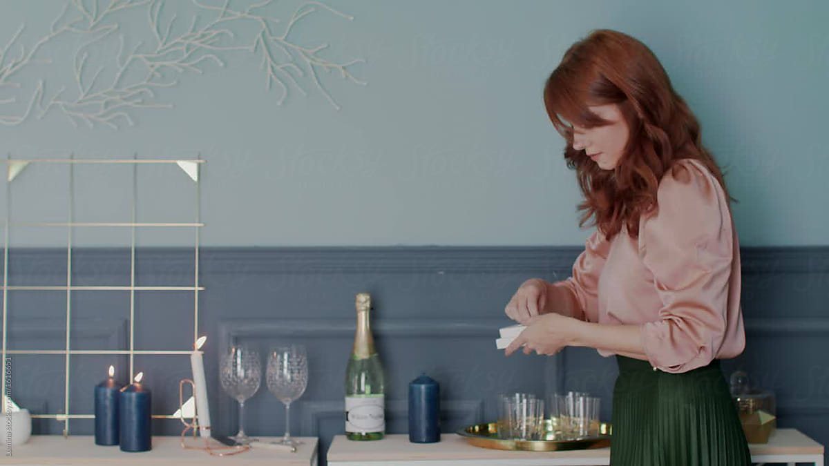 "Woman Lighting Up Candles" by Stocksy Contributor "Lumina" - Stocksy