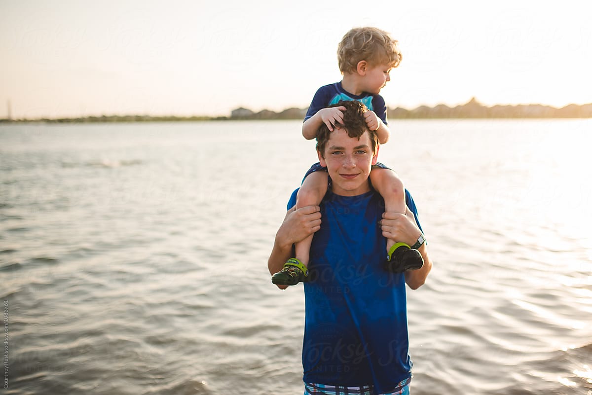 "Brothers At The Beach" by Stocksy Contributor "Courtney Rust" - Stocksy