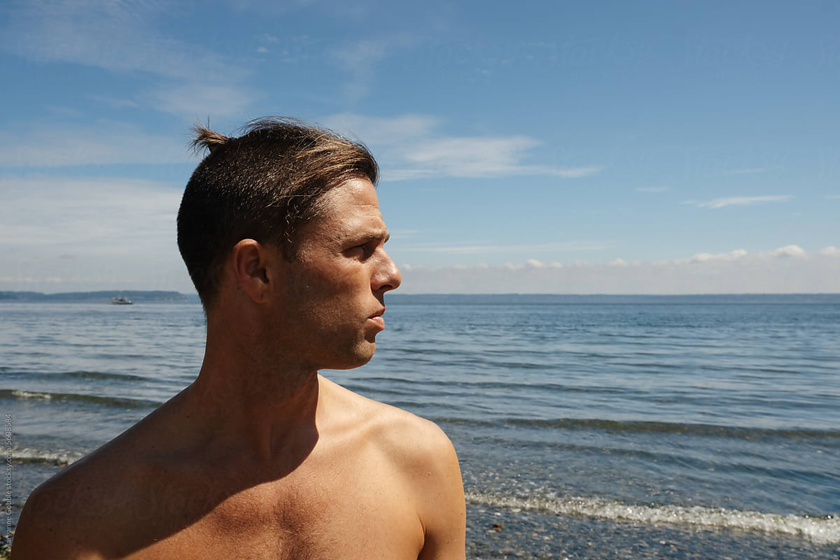 "Man On Sunny Beach" by Stocksy Contributor "Maryanne Gobble" - Stocksy