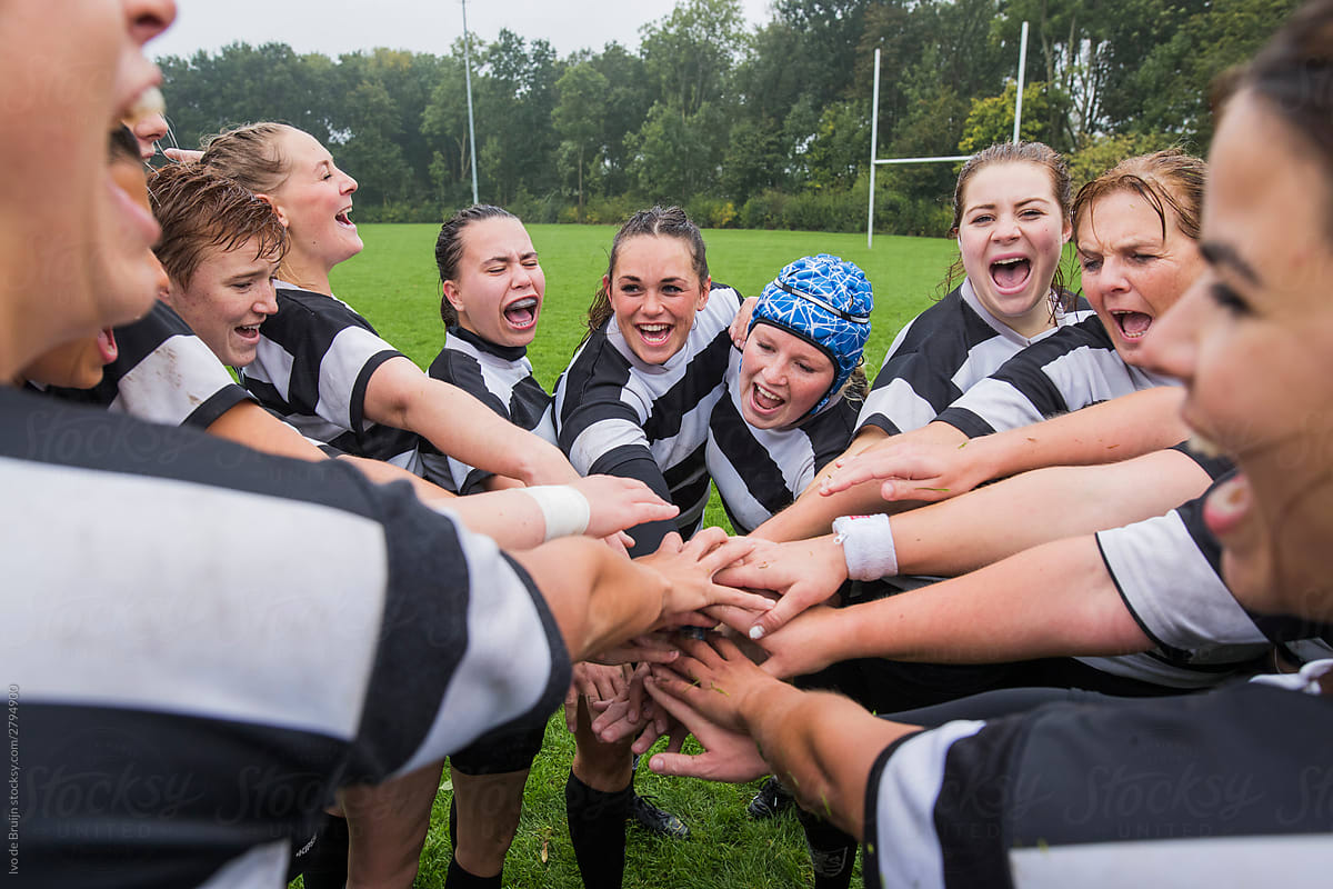 "Team Of Female Rugby Players Cheering A Yell During A Game." by ...