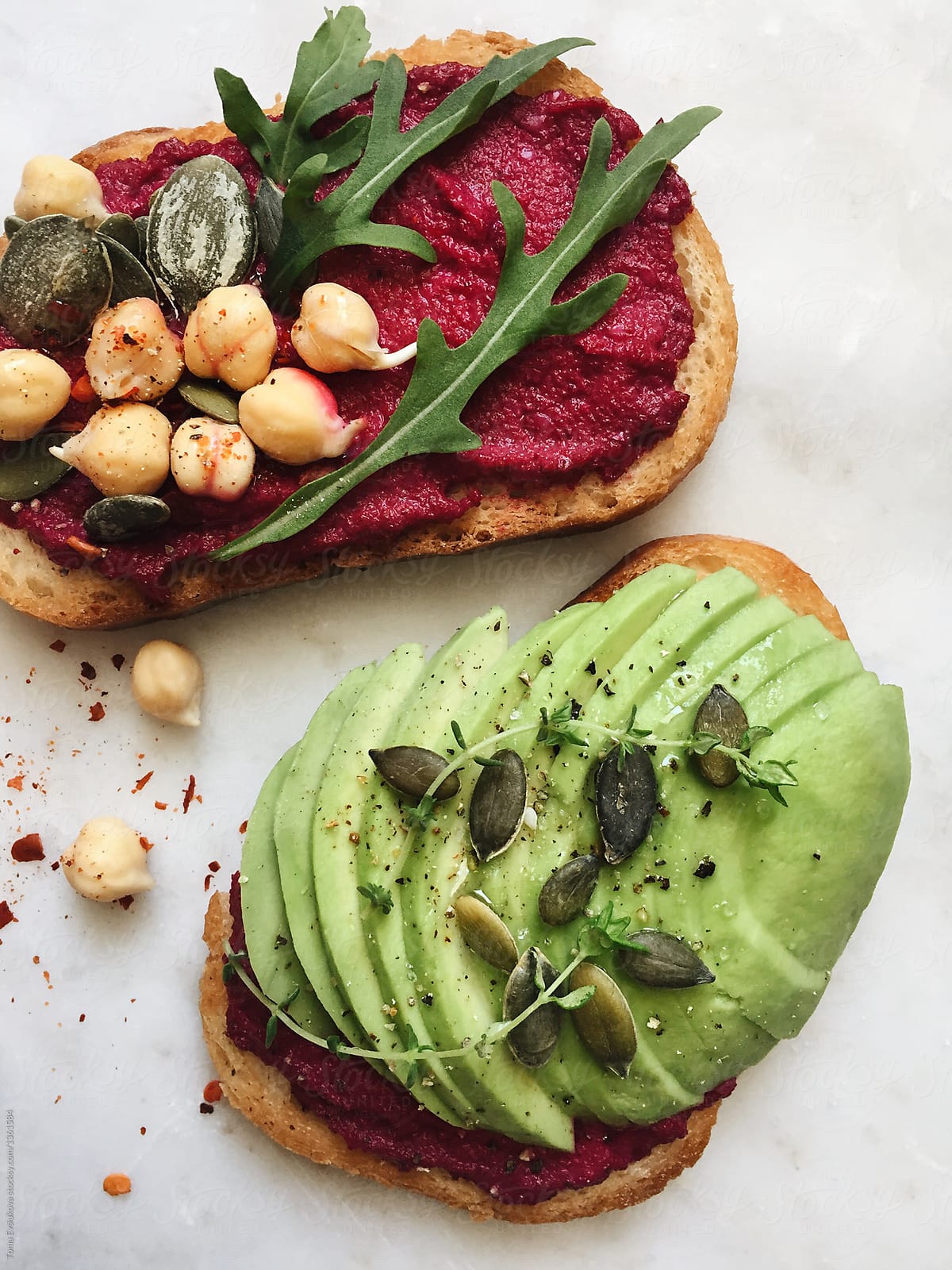 "Toasts With Avocado And Beetroot Hummus" by Stocksy Contributor "Toma ...