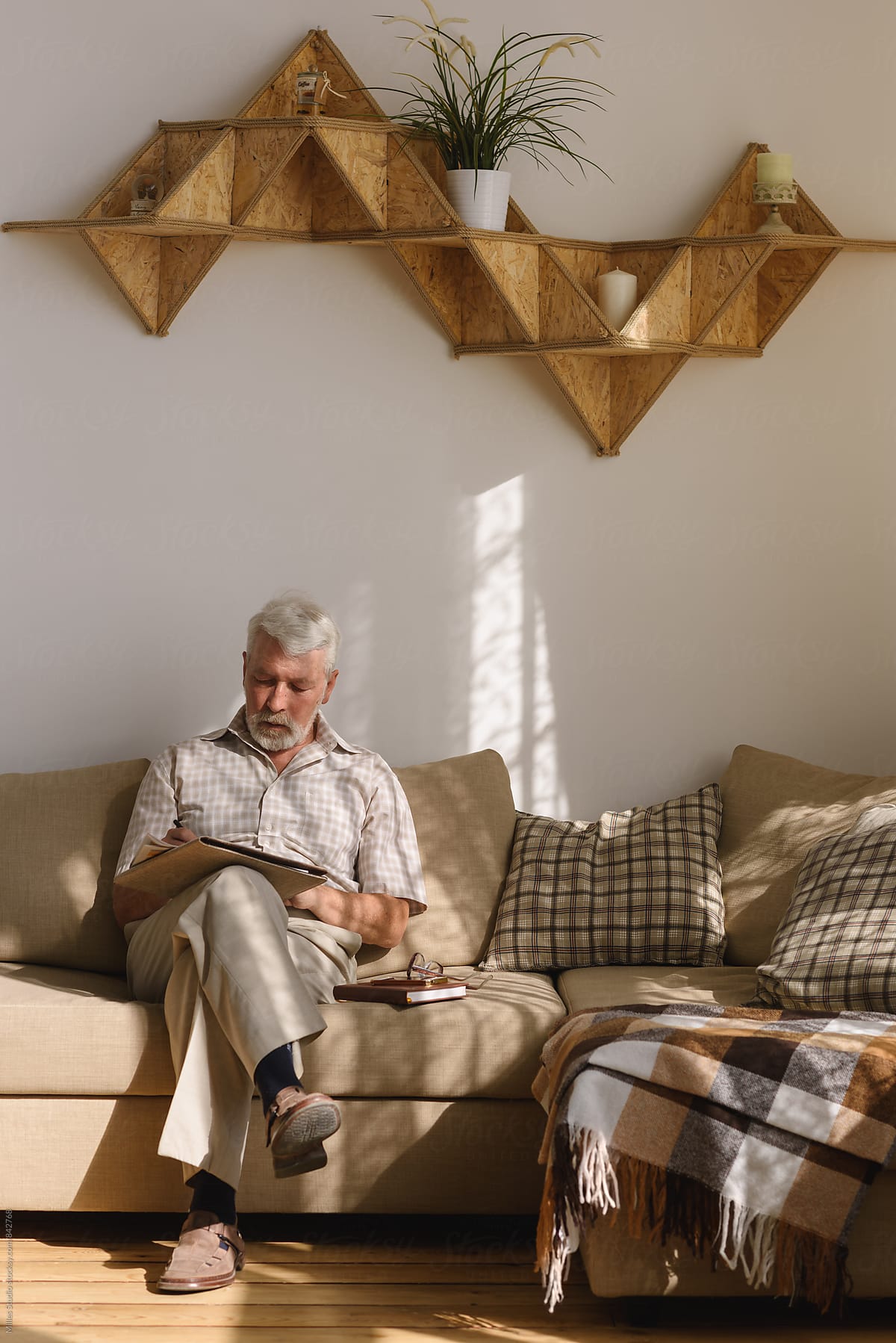 "Old Man At Home" by Stocksy Contributor "Milles Team" - Stocksy