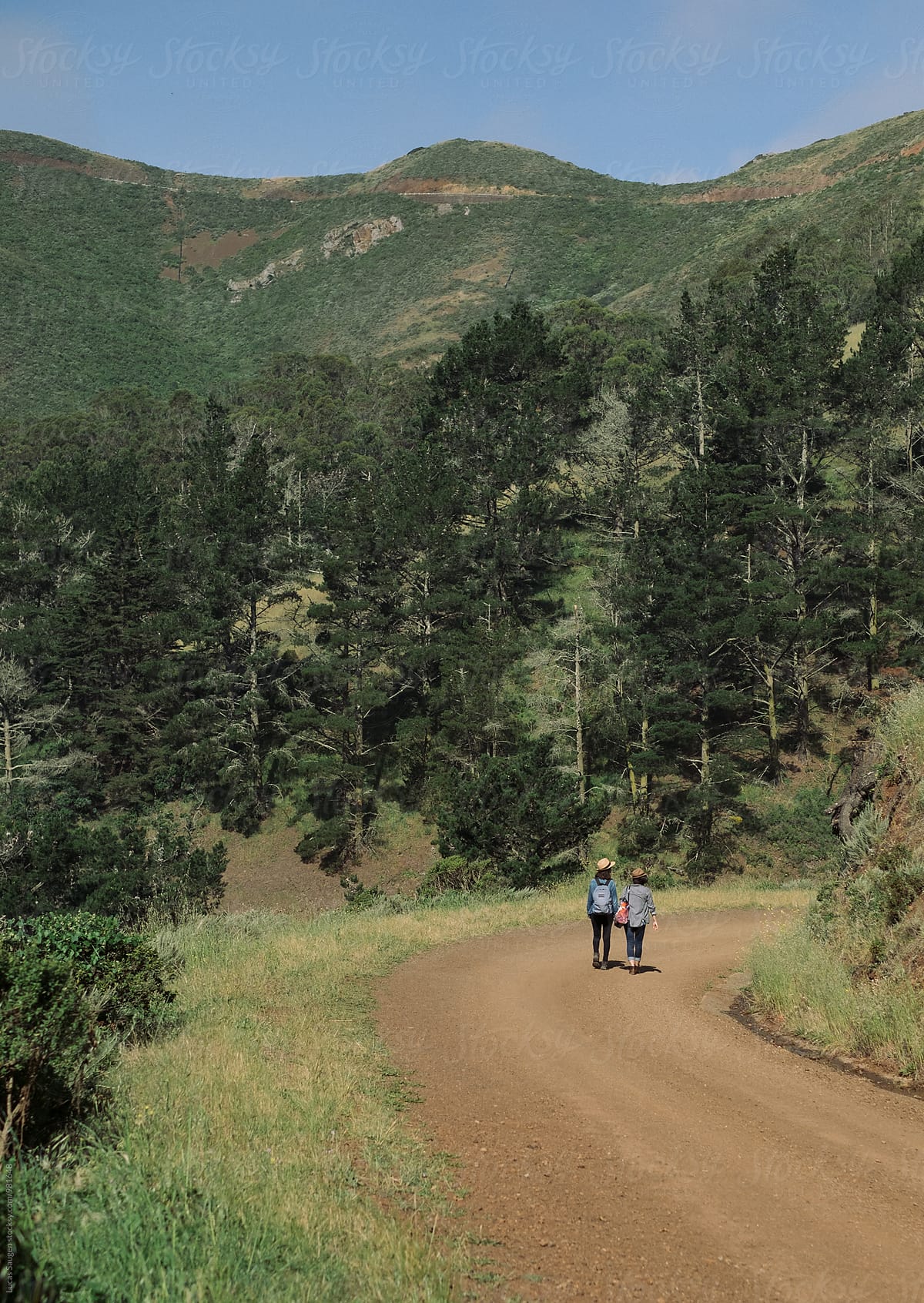 "Two Woman Take A Hike Down A Road." by Stocksy Contributor "Lucas ...