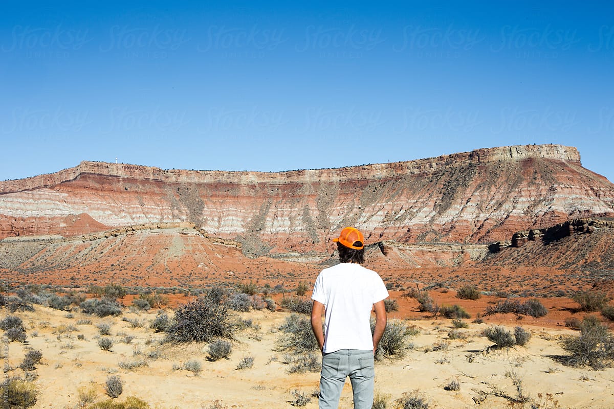 "Man Looking Out At Amazing Desert Rock Formation" by Stocksy ...