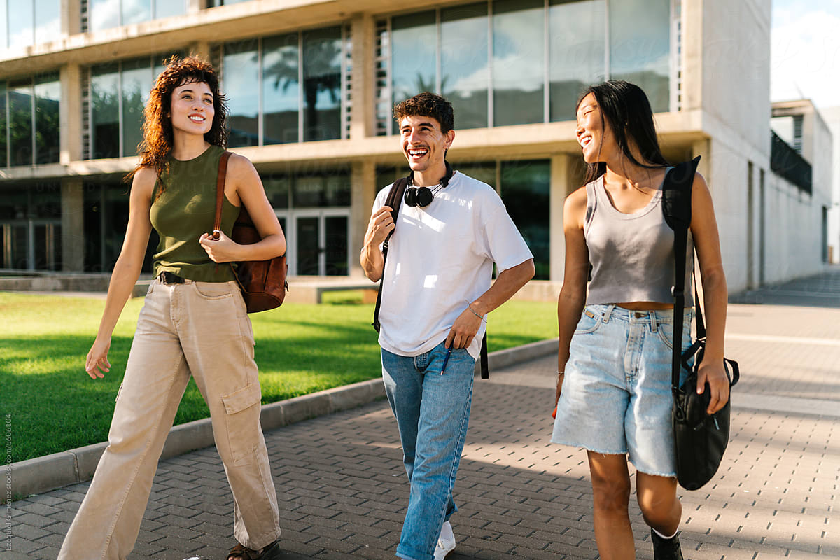 "Happy University Students Walking Down The Street" by Stocksy ...