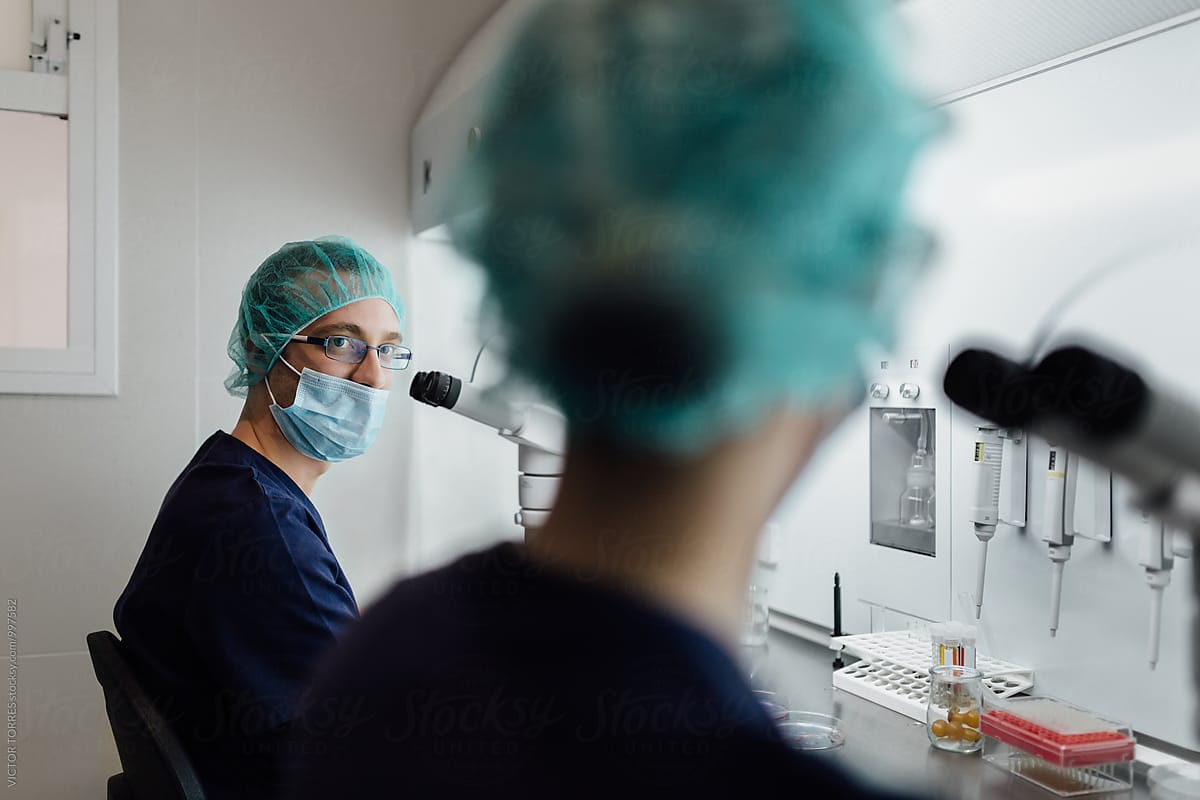 Young Biologist Using a Microscope in the Laboratory - Stock Image ...