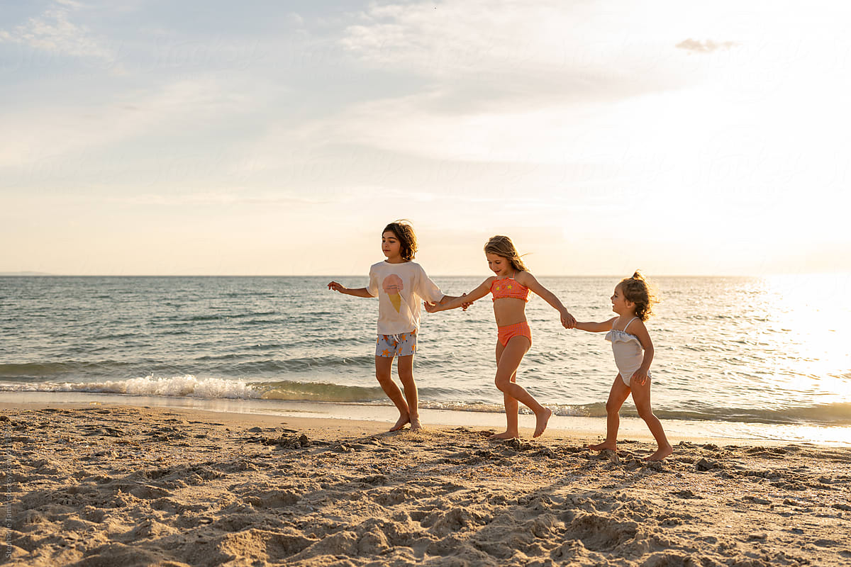 "Siblings Playing At The Beach At Golden Hours" by Stocksy Contributor ...