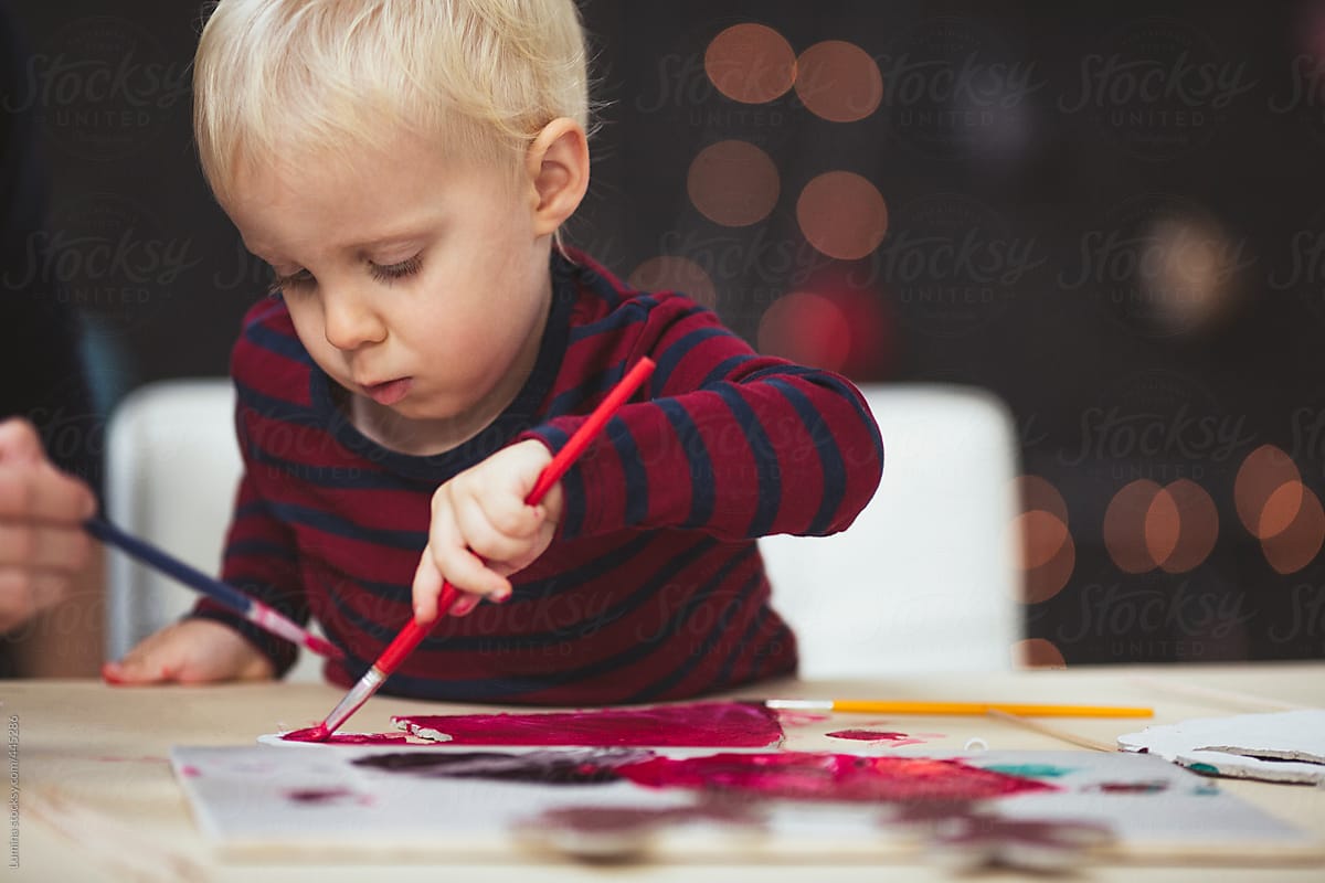 "Cute Boy Colouring Christmas Masks" by Stocksy Contributor "Lumina ...