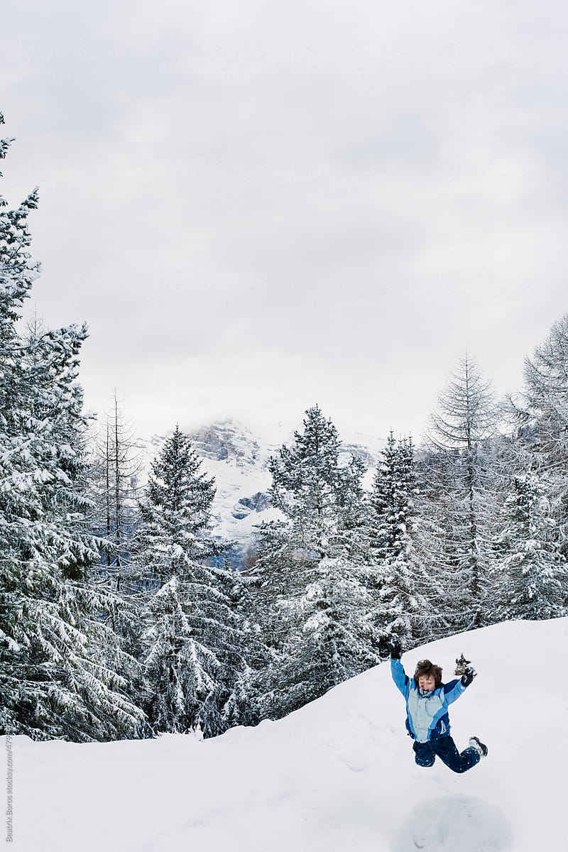 "Boy Jumping In The Snow From A Huge Snowball" by Stocksy Contributor ...