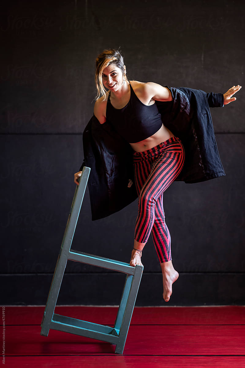 "Female Acrobat Doing Handstand On Chair" by Stocksy Contributor ...