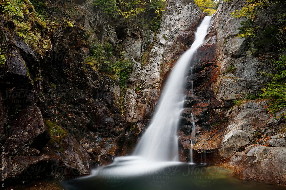 "Glenn Ellis Falls" by Stocksy Contributor "Paul Tessier" - Stocksy
