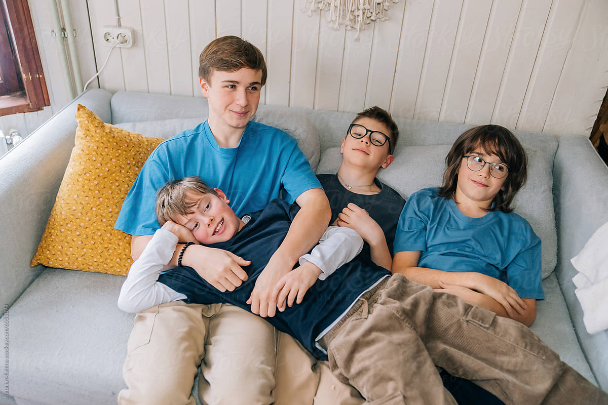 "Group Of Friends Relaxing Together At Home On A Cozy Couch" by Stocksy ...