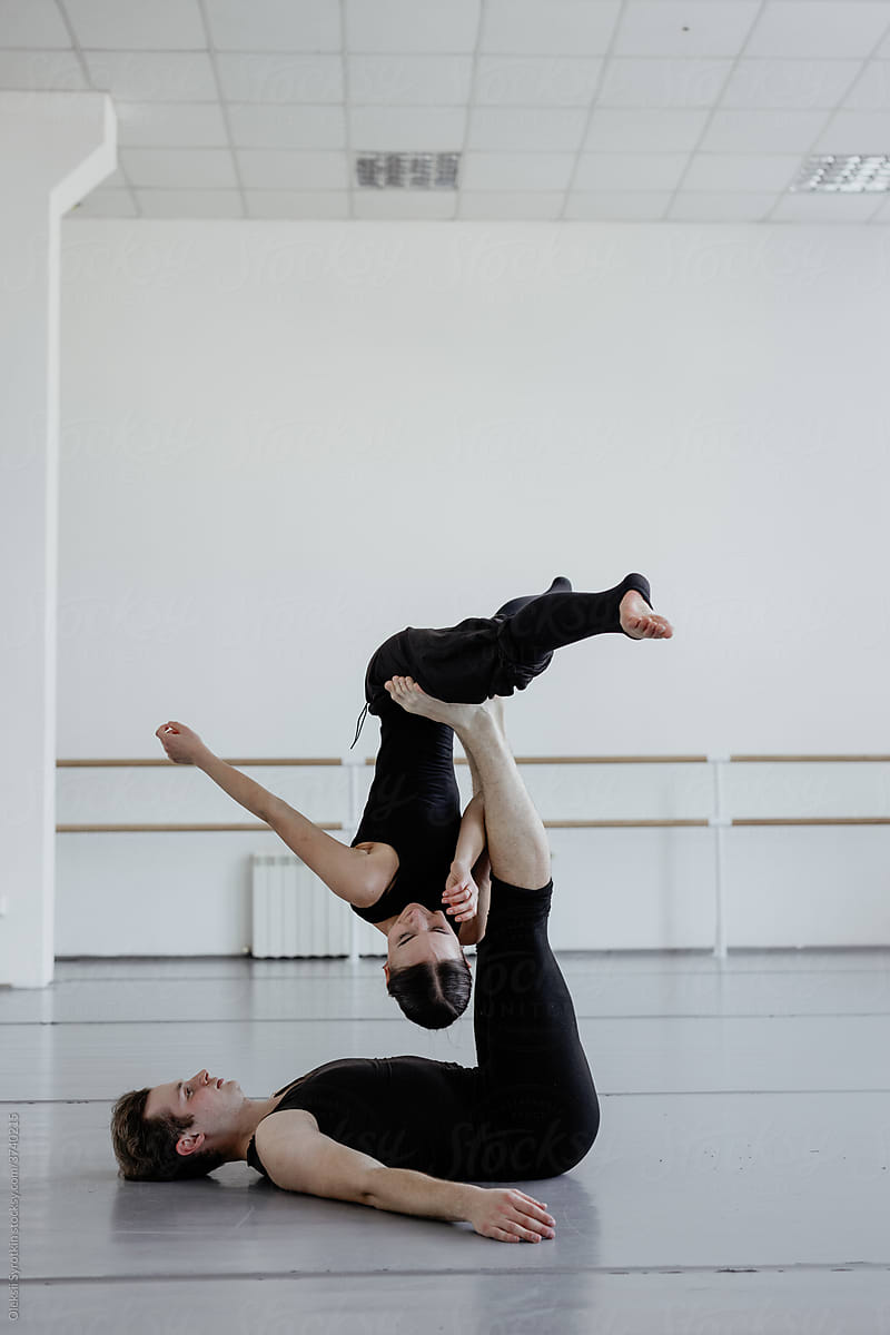 Gymnasts practicing movement together - Stock Image - Everypixel