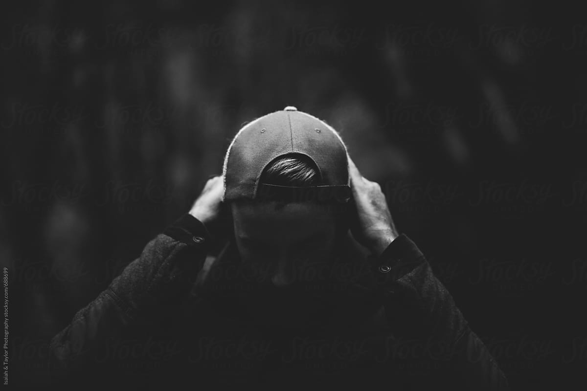 "Young Trendy Man Putting On Hat" by Stocksy Contributor "Itla" - Stocksy
