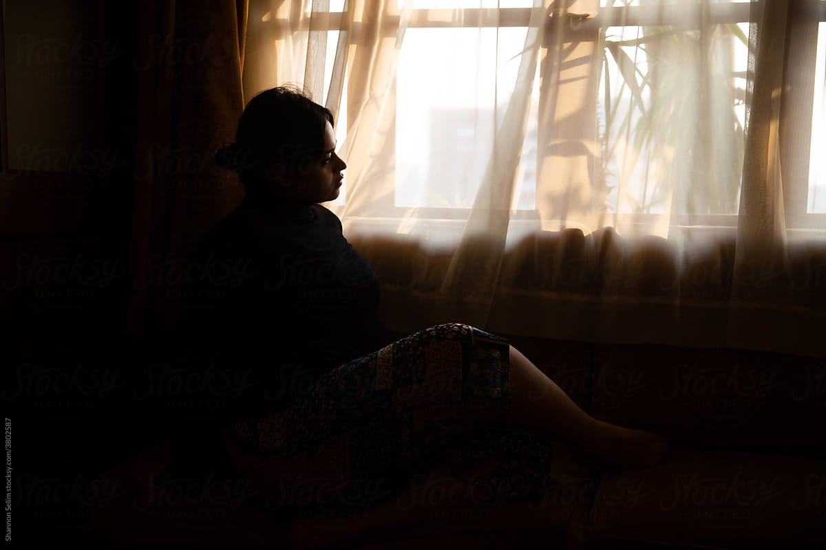 "Pensive Woman Looking Out Window" by Stocksy Contributor "Shannon ...