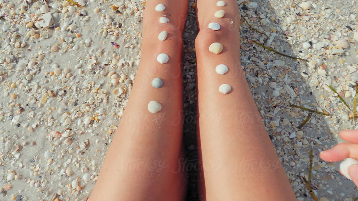 "Woman Placing Beach Shells On Skin" by Stocksy Contributor "Maryanne ...