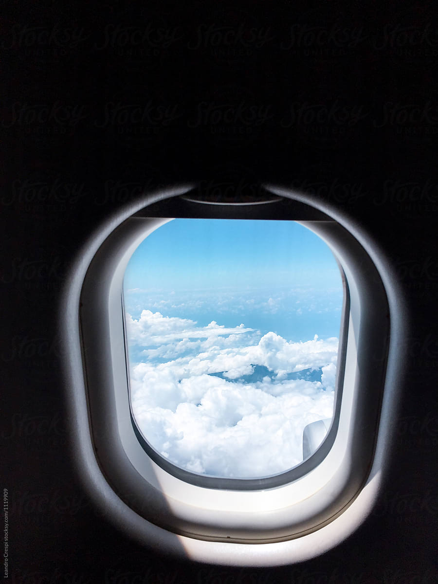 "Cloudy Sky From A Plane Window" by Stocksy Contributor "ohlamourstudio ...