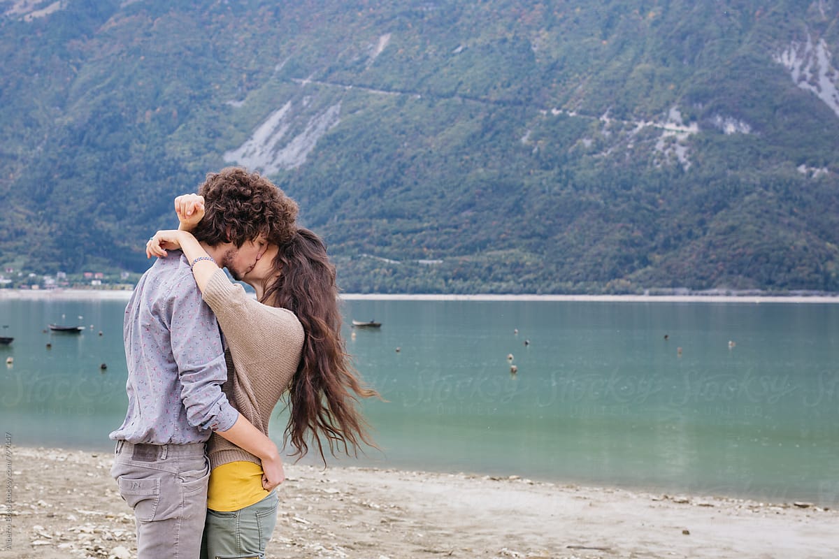 "Young Couple Kissing At The Lake" by Stocksy Contributor "Studio Serra ...